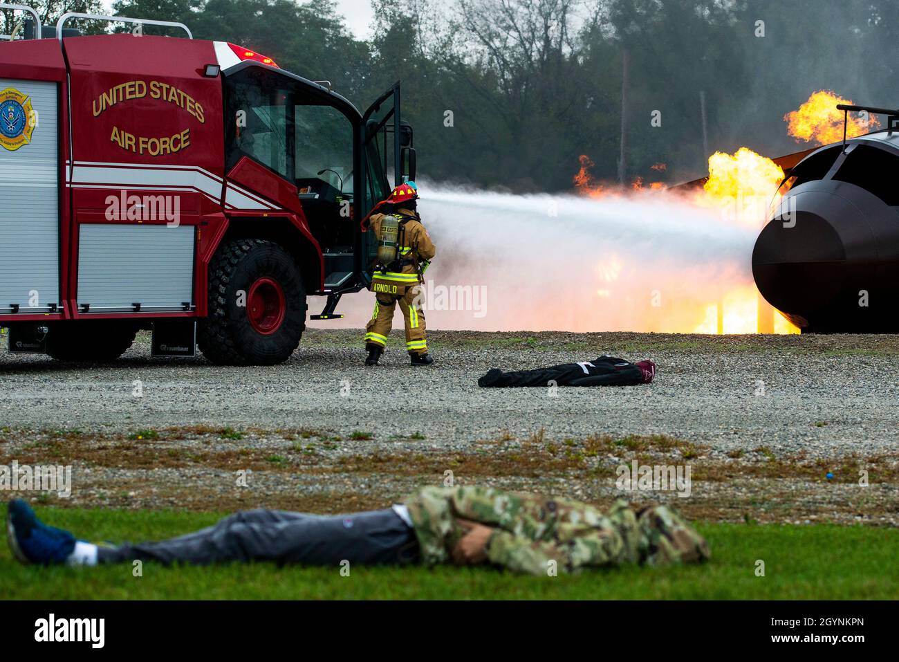 Members of the 788th Civil Engineer Squadron Fire Department work to ...