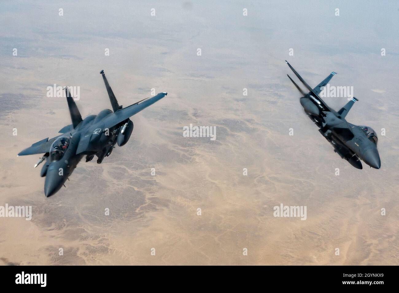 Two U.S. Air Force F-15E Strike Eagle aircraft fly in formation during ...