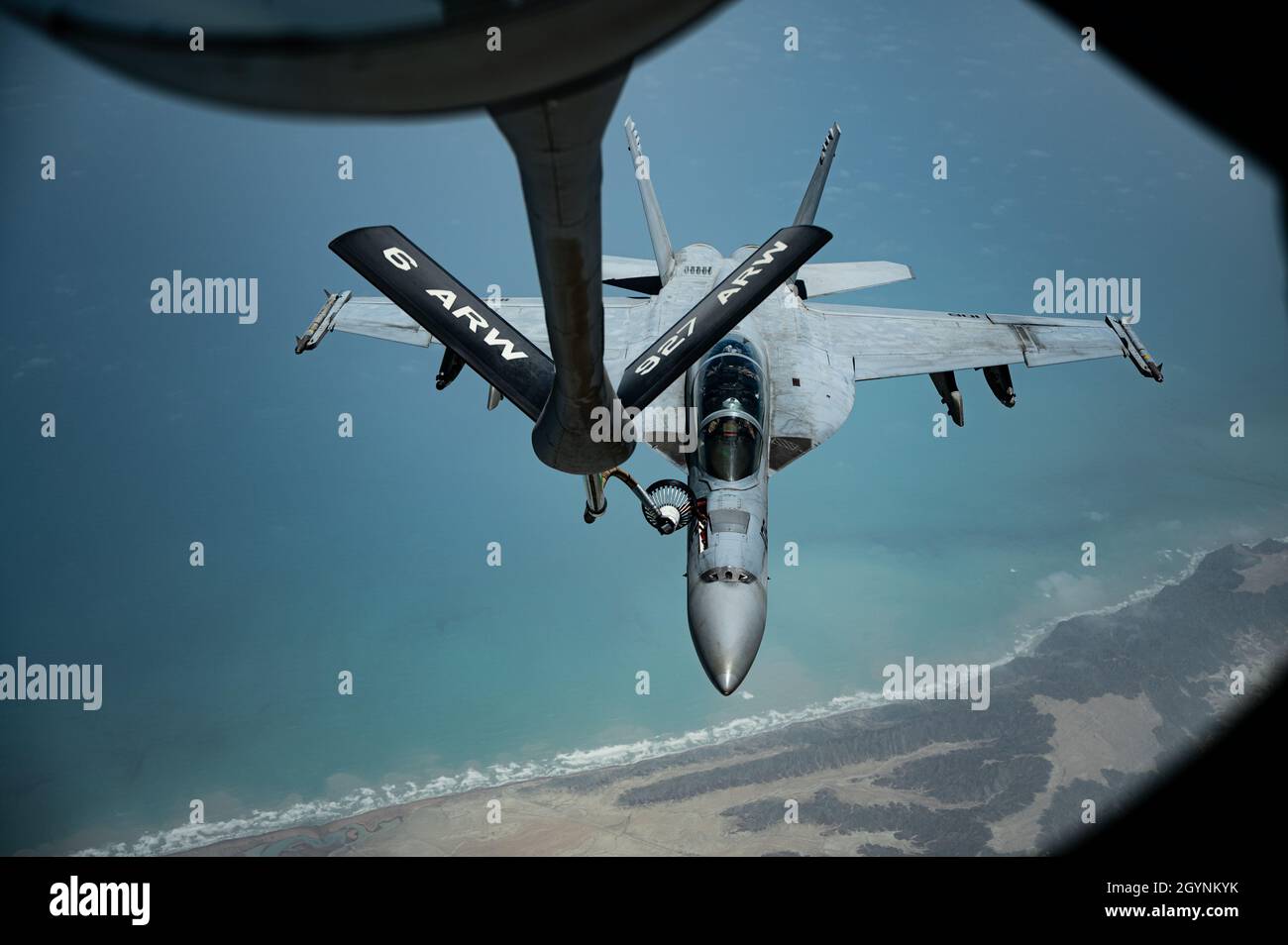 A U.S. Navy F/A-18 Super Hornet receives fuel from a U.S. Air Force KC ...