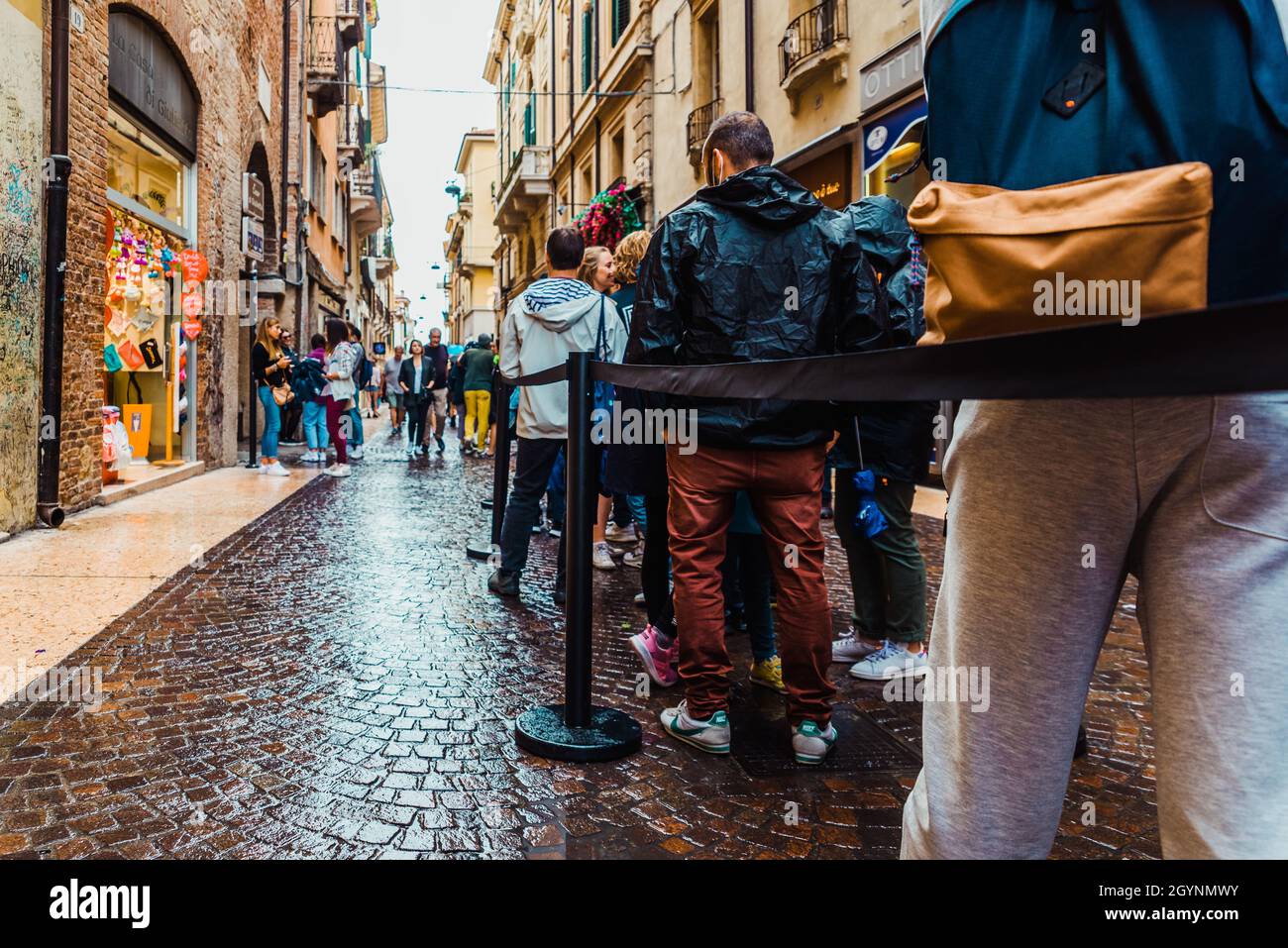 Verona, Italy - October 2, 2021: A long queue of tourists waits to ...