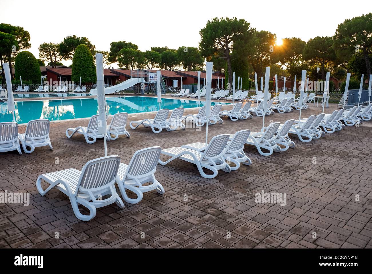 Plastic hammocks near the pool, empty by the end of the summer season ...