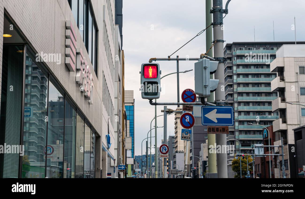 The cross traffic light is on red for pedestrians at the city street ...