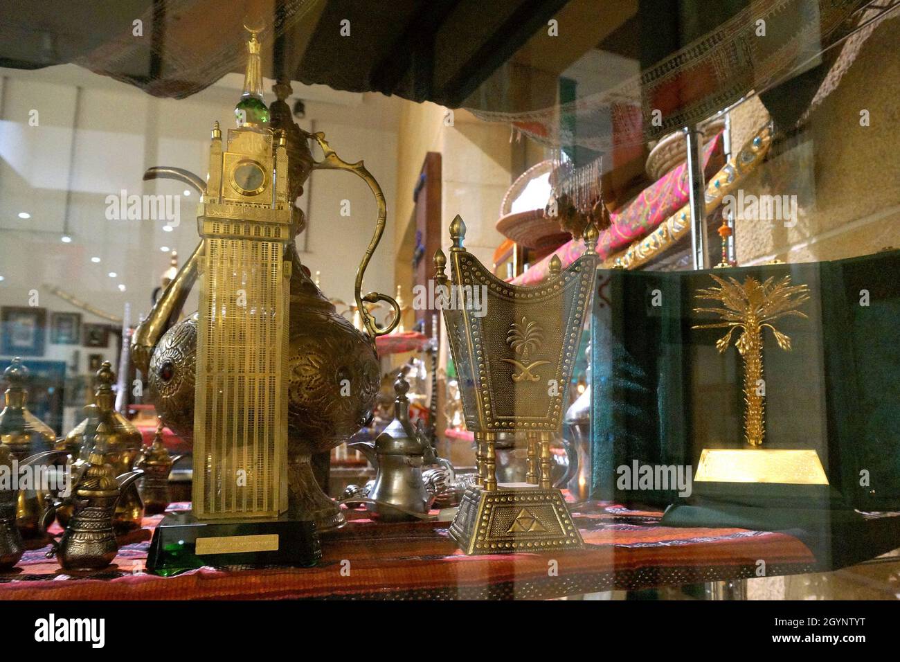 Golden Arabic items displayed in a shop. Photo taken in Riyadh, Saudi ...