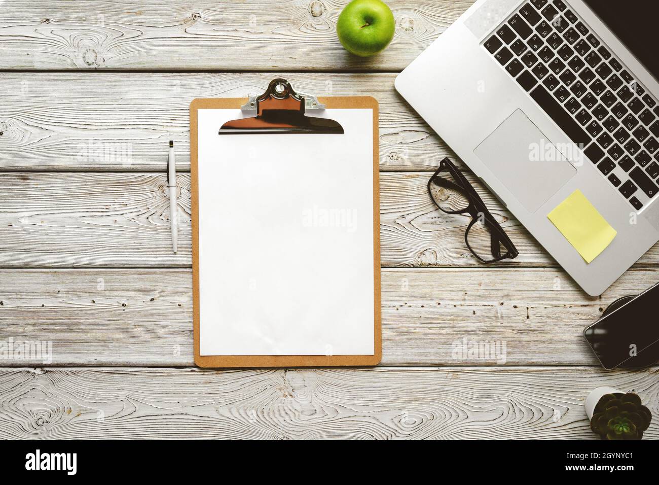 Office table workspace top view. Wooden desk with laptop, devices and ...