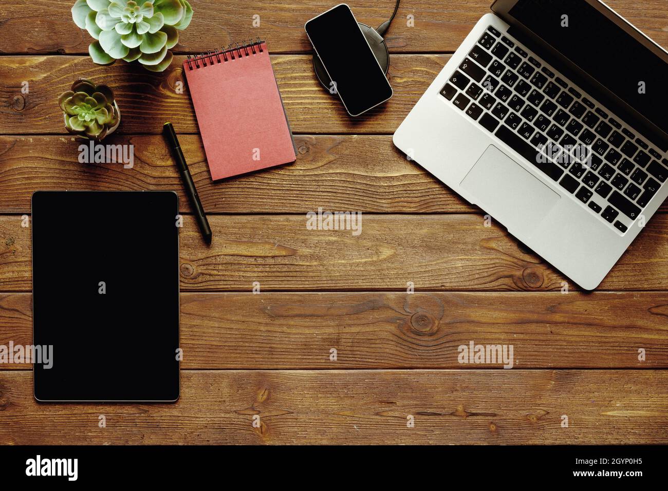 Office table workspace top view. Wooden desk with laptop, devices and ...