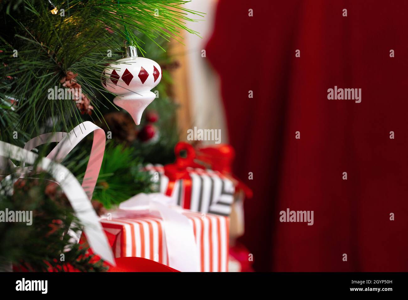 Pile of wrapped presents under the Christmas tree Stock Photo - Alamy