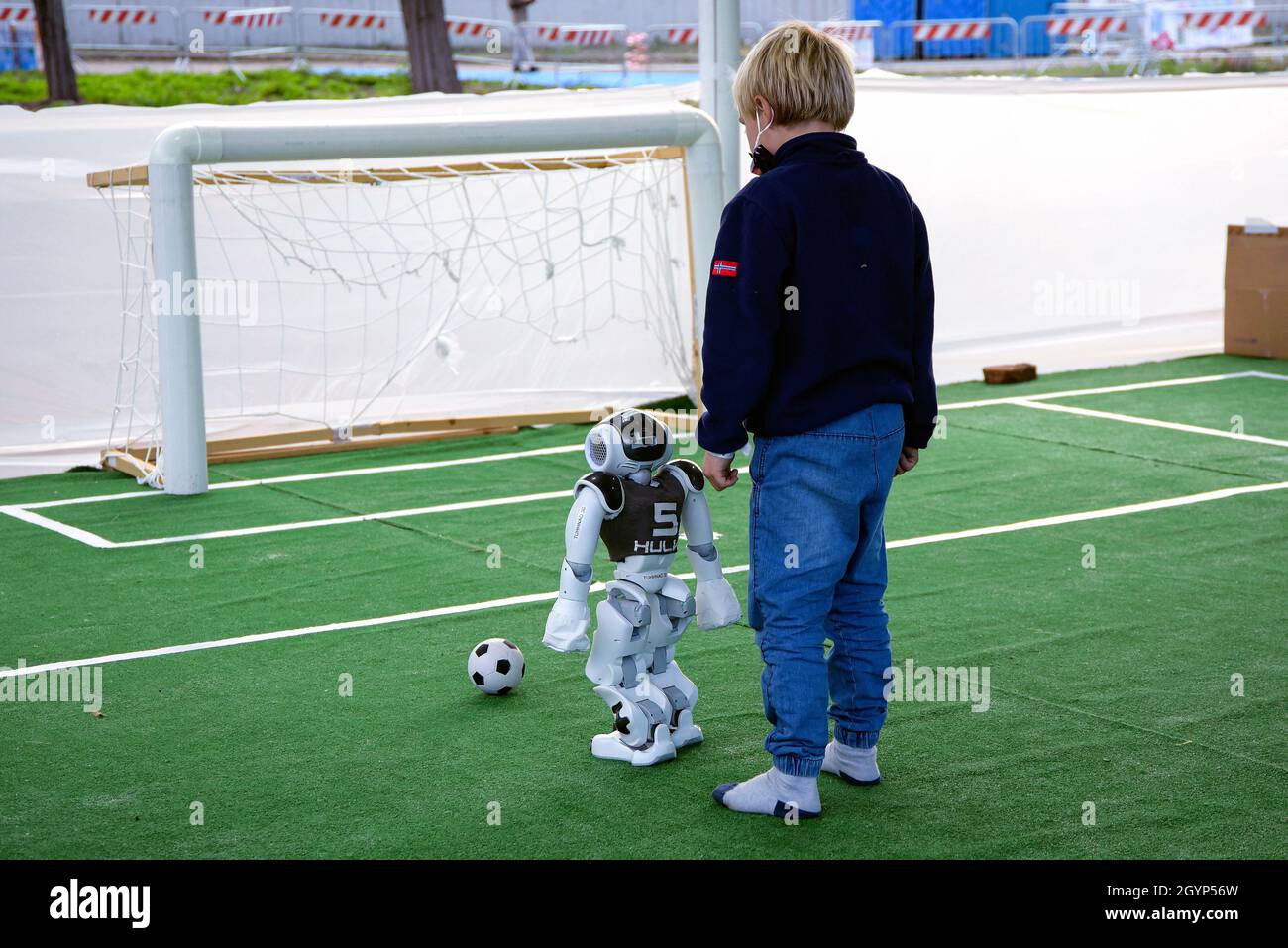 Rome, Italy. 08th Oct, 2021. A child interacts with a robot footballer ...