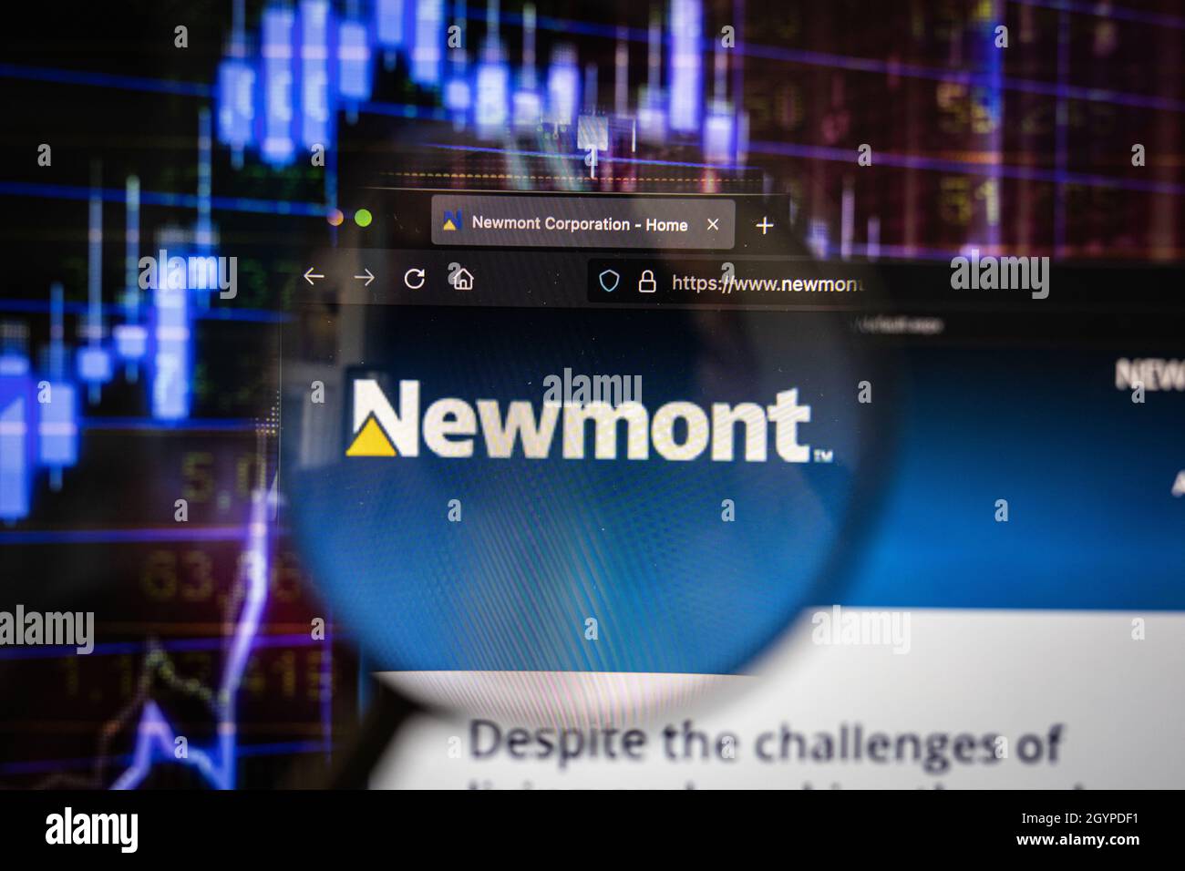 Newmont company logo on a website with blurry stock market developments ...
