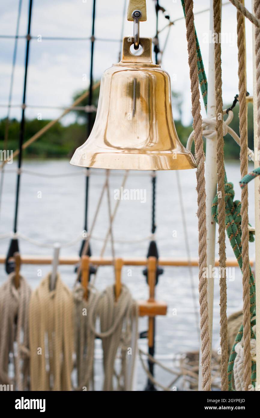 bell and sea sail on the ocean background Stock Photo - Alamy
