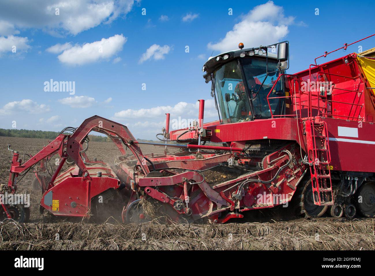 potato harvester machine on the field Stock Photo - Alamy