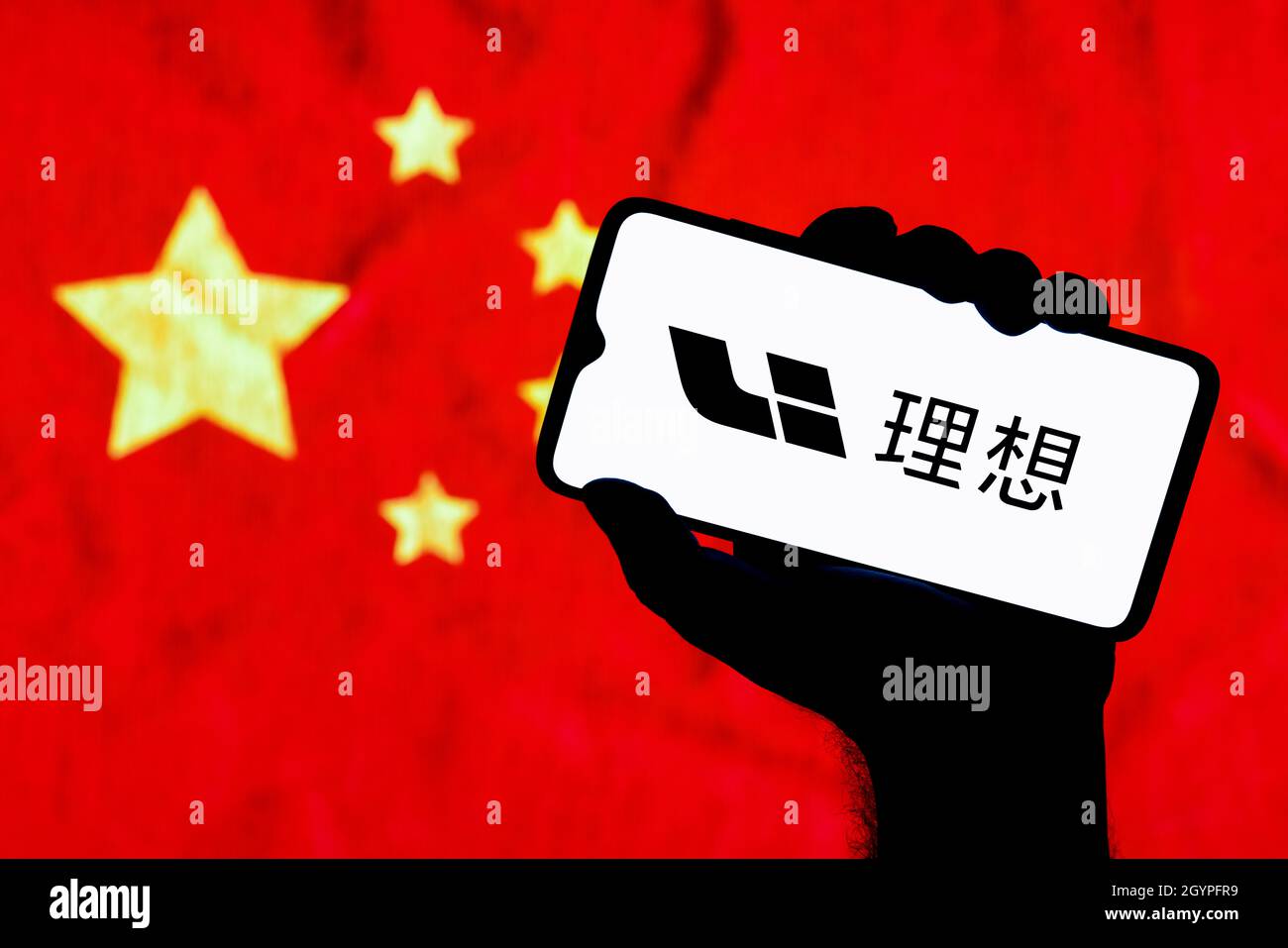 Li Auto is a chinese electric vehicle manufacturer. A smartphone with ...