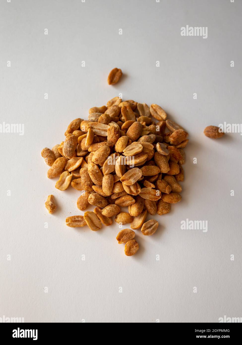 Roasted chili lemon peanuts on white background Stock Photo - Alamy