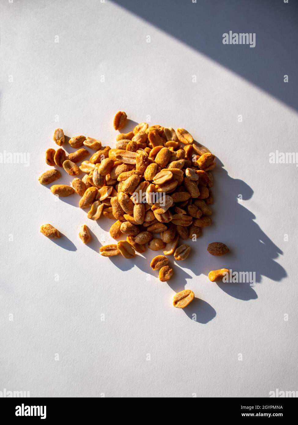 Roasted chili lemon peanuts on white background Stock Photo - Alamy