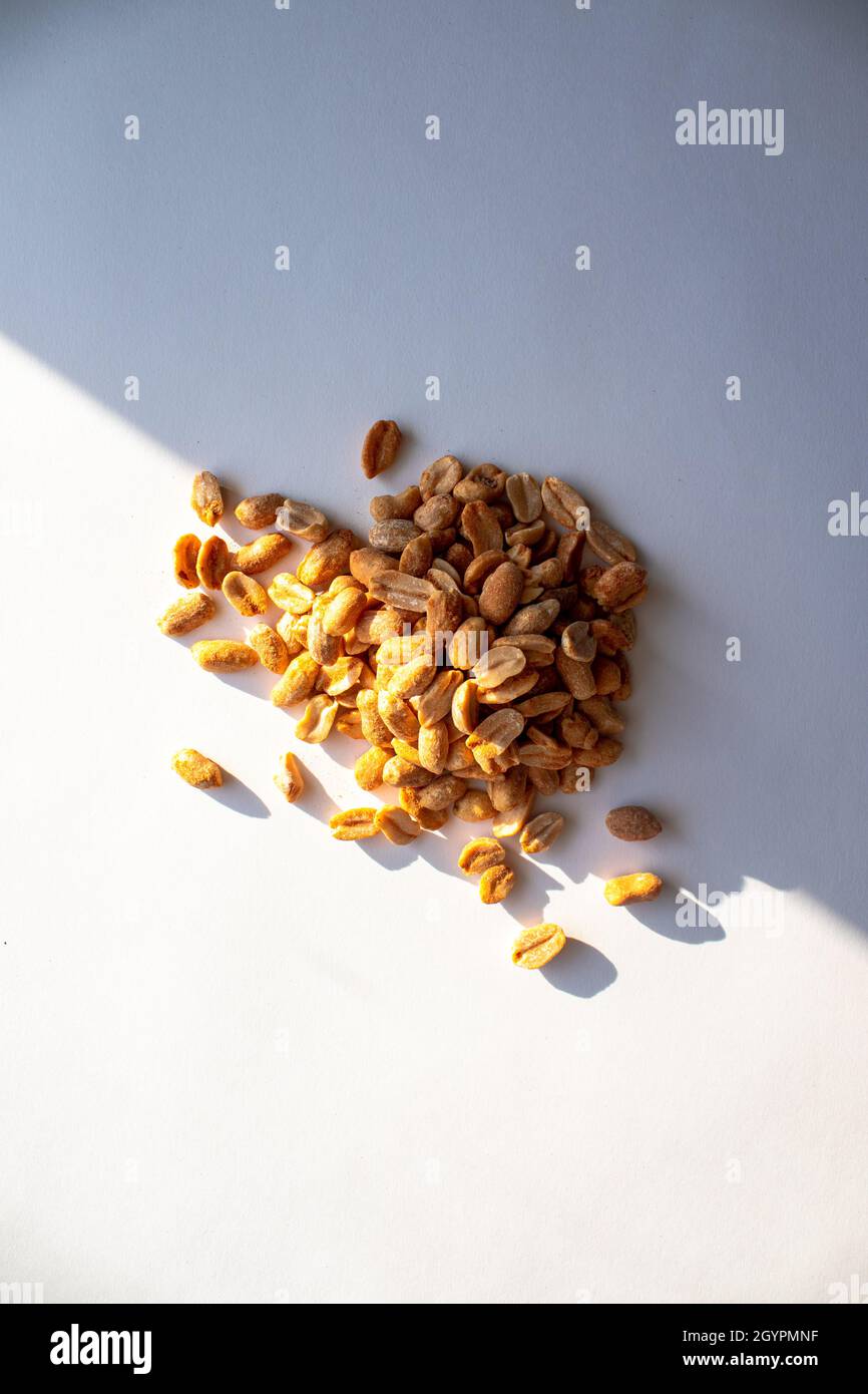 Roasted chili lemon peanuts on white background Stock Photo - Alamy