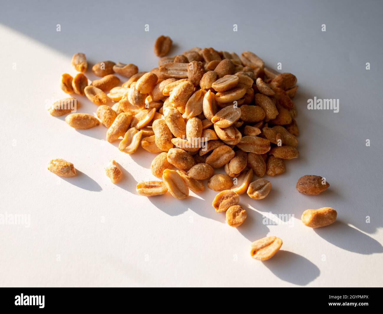 Roasted chili lemon peanuts on white background Stock Photo - Alamy
