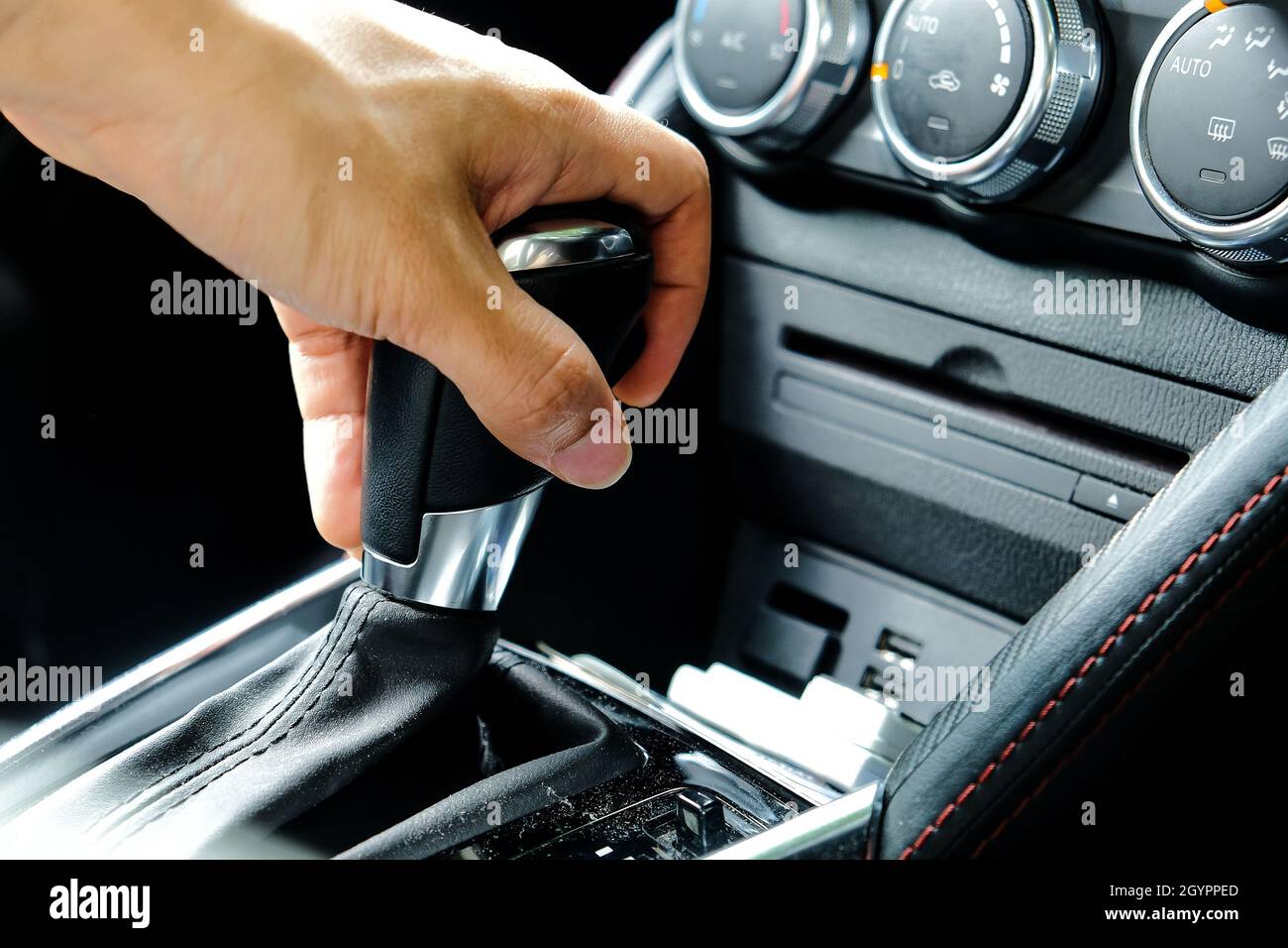 Hand on automatic gear shift Stock Photo - Alamy