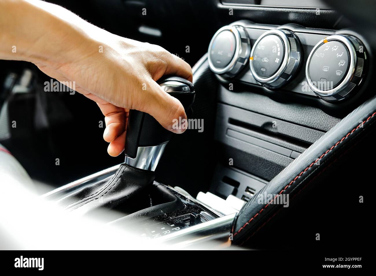 Hand on automatic gear shift Stock Photo - Alamy