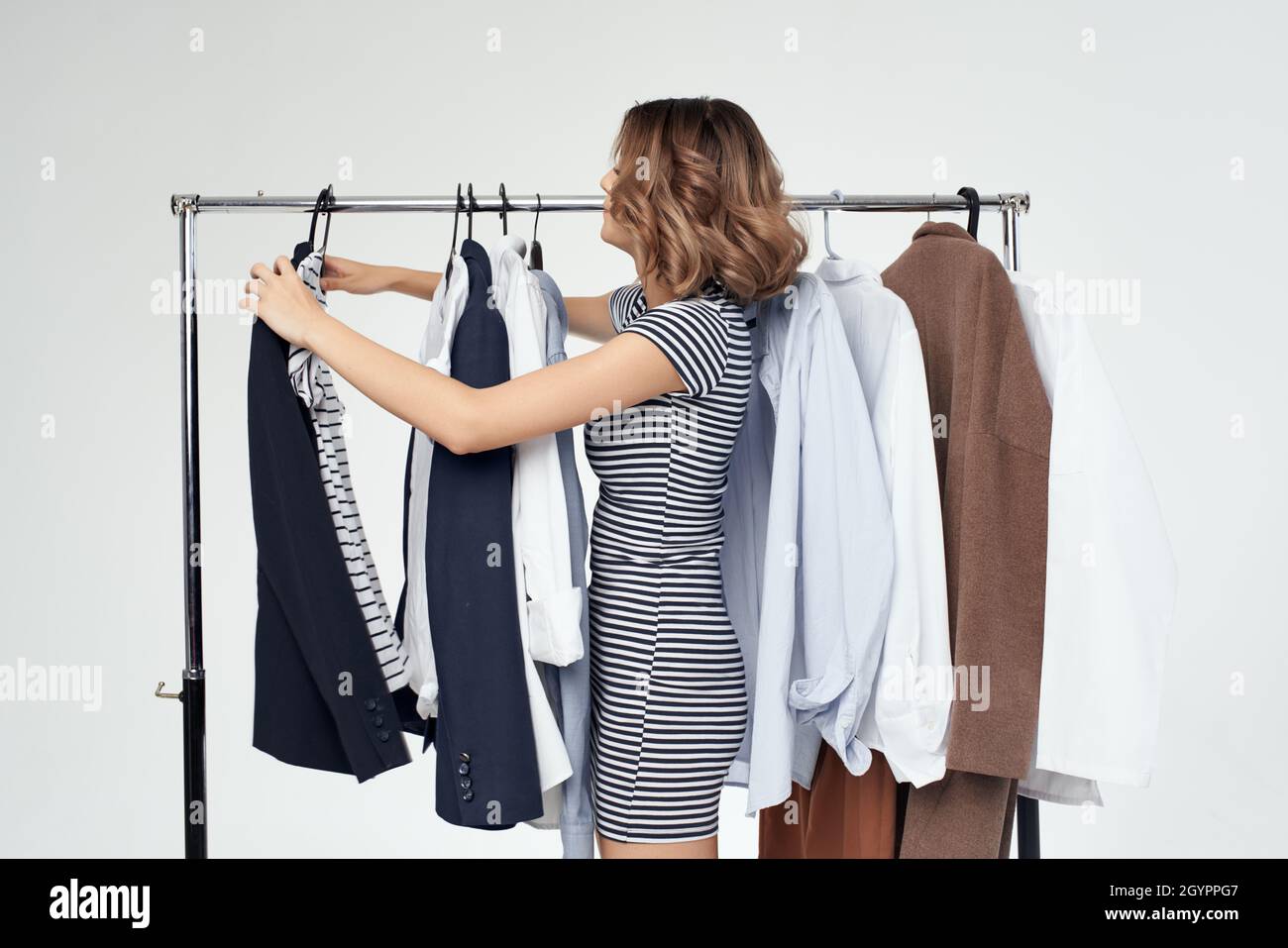 beautiful woman trying on clothes shop retail isolated background Stock ...