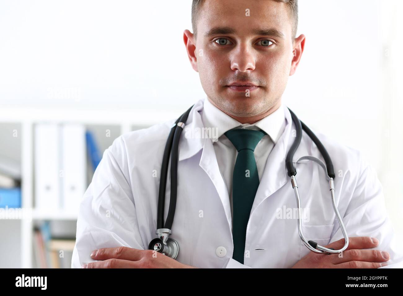Male medicine doctor hands crossed on his chest Stock Photo - Alamy