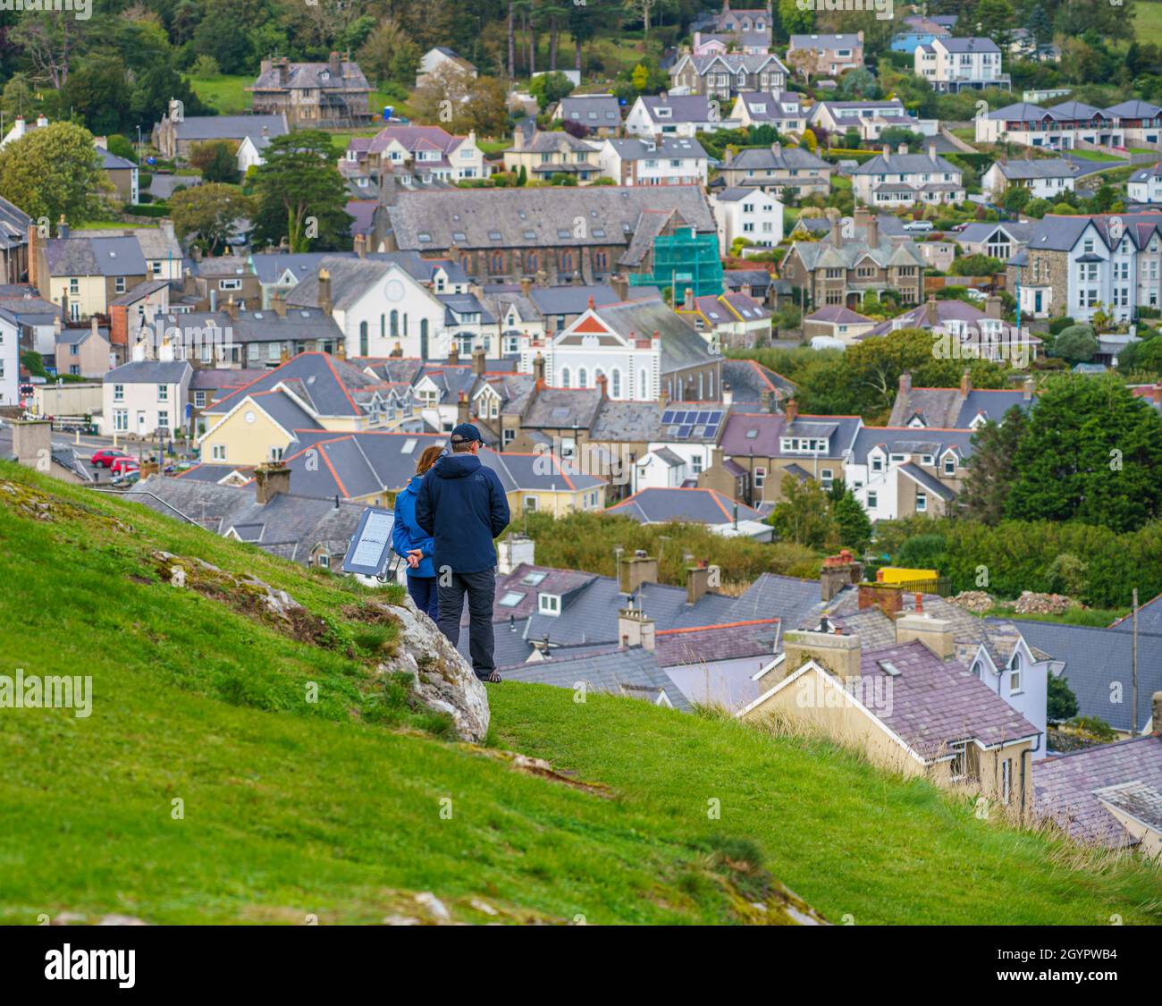 2 people admire the view from the medieval Castell Criccieth, Gwynedd ...