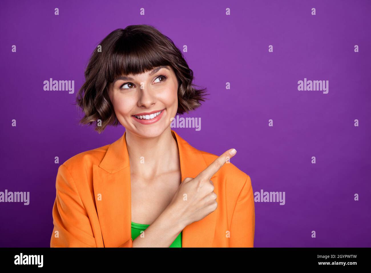 Photo of cute millennial brunette lady point look empty space wear ...