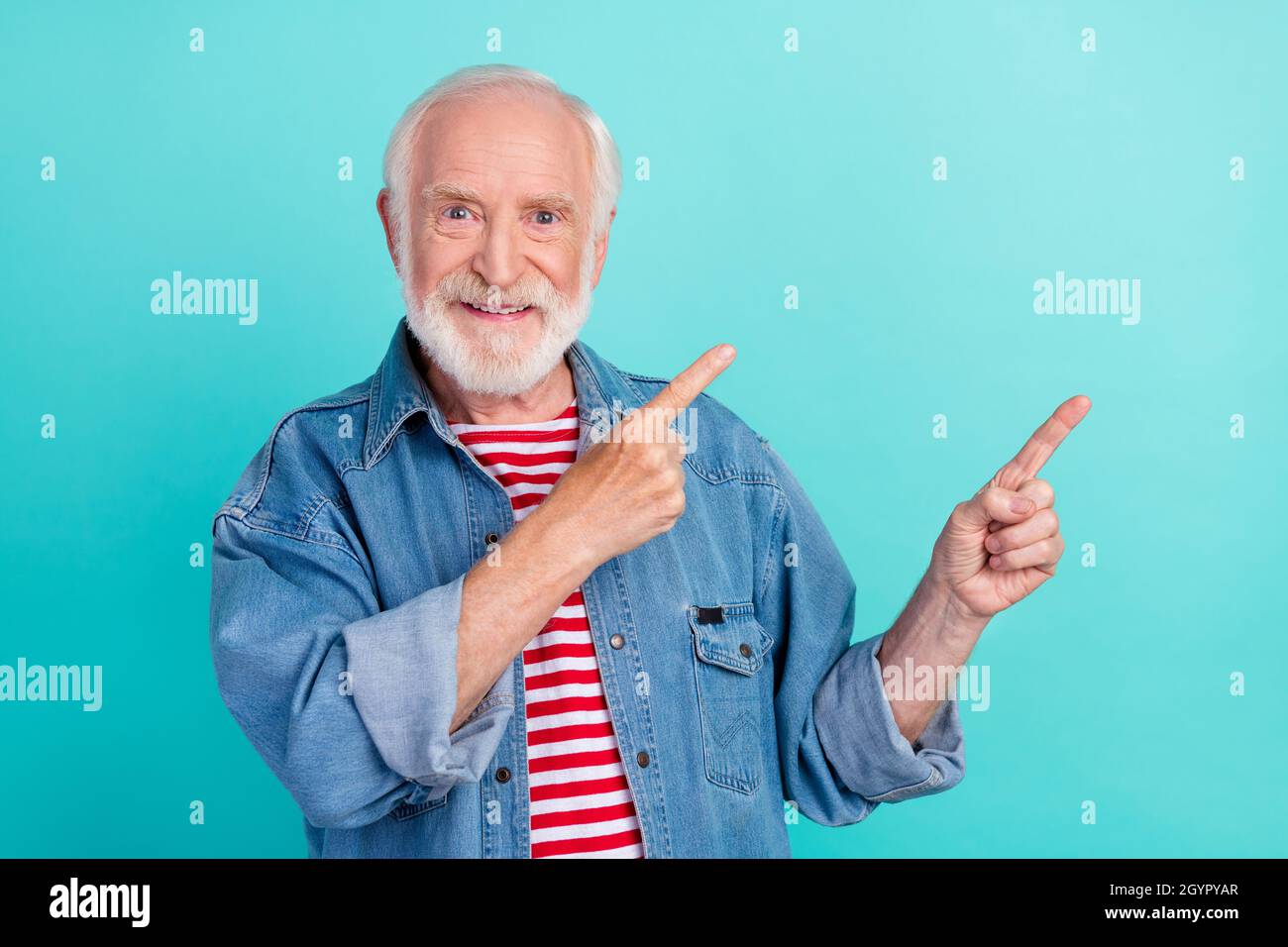 Portrait of attractive cheerful grey-haired man showing copy space ...