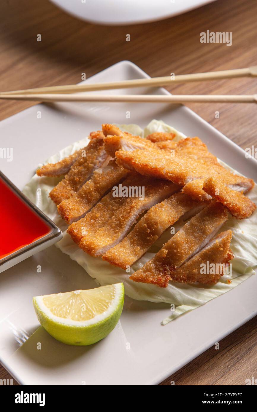 Oriental style battered chicken fillet with sweet and sour sauce ...