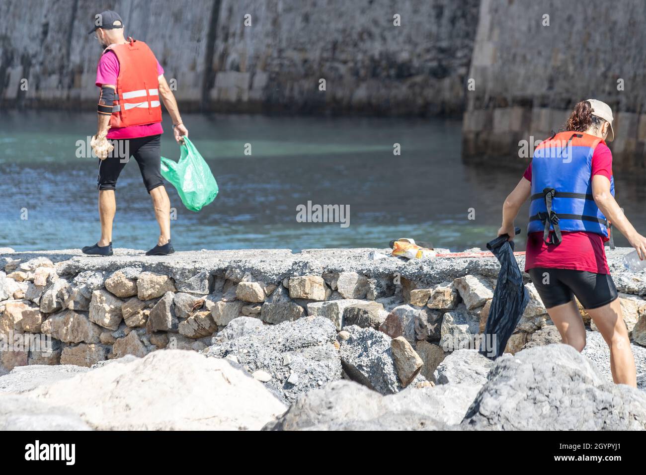 Volunteers collect plastic garbage hi-res stock photography and images ...