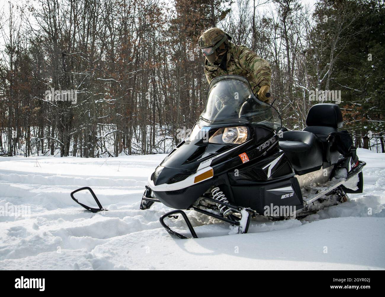 A U.S. Air Force Special Tactics operator rides a snowmobile during ...