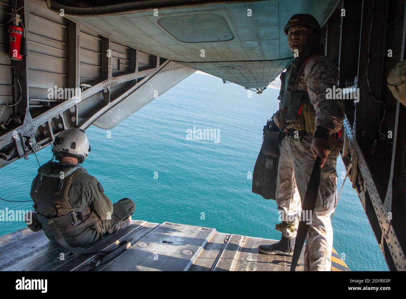 U.S. Marine Corps Staff Sgt. Marcos Vidal, right, a team leader with ...