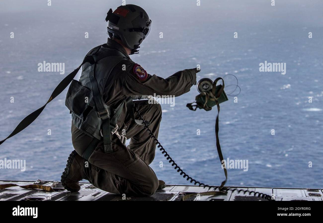 Tech. Sgt. Seth Dunworth, 15th Airlift Squadron loadmaster, deploys an ...