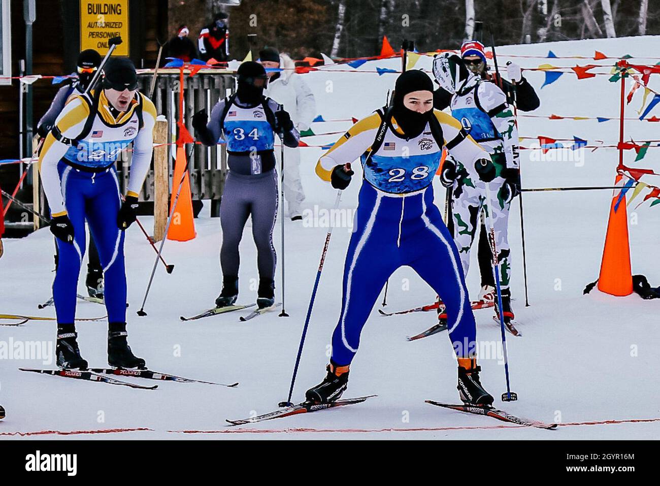 Peter Senatore (bib 29) cheers on Brandon Quach (28) at the start of ...