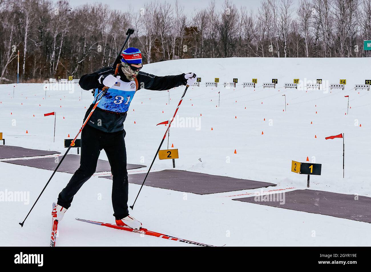 Scott Wilhite of Wisconsin, skis through the range after shooting ...
