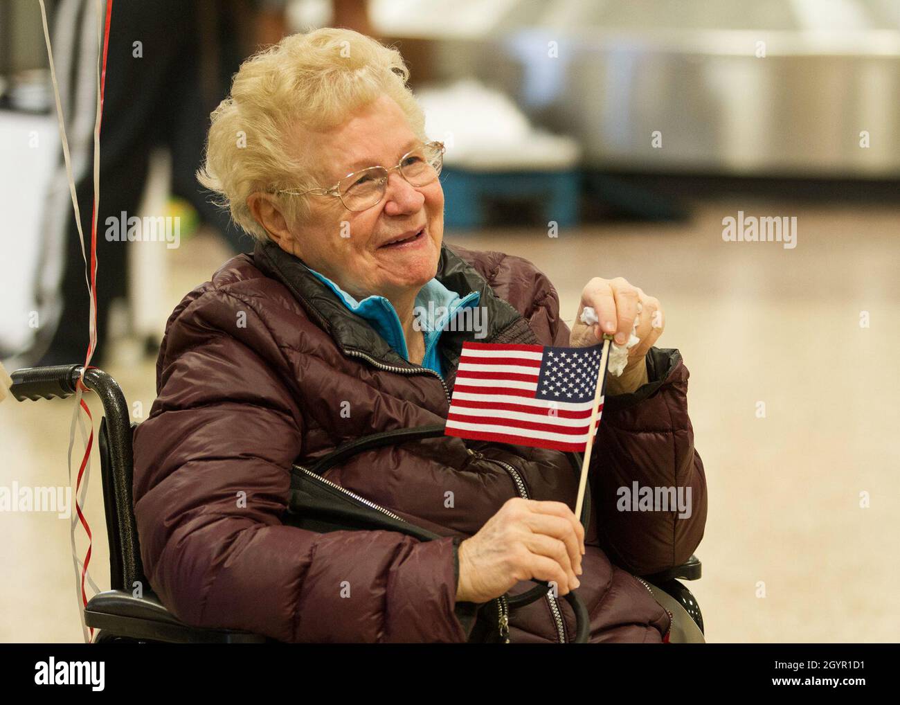 Friends and family gather at the Salt Lake International airport ...