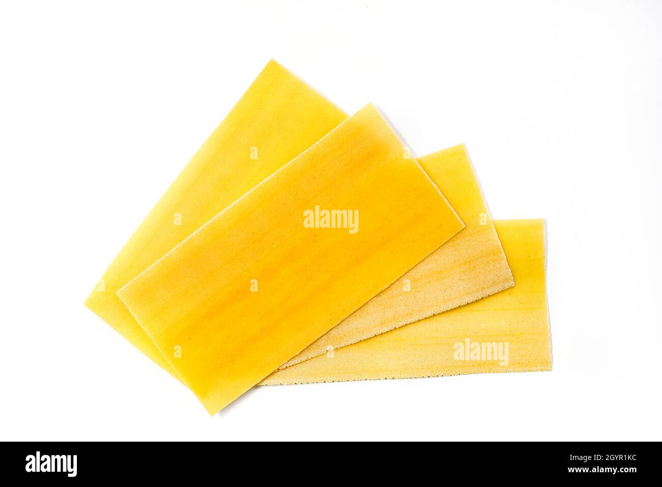 Uncooked raw lasagna pasta isolated on white background. Stack of dried ...