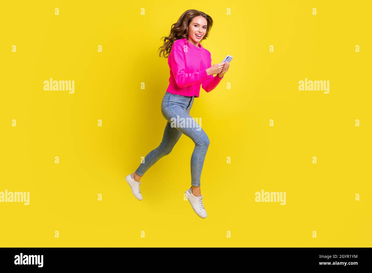 Full length photo of shiny lady dressed pink pullover walking jumping ...