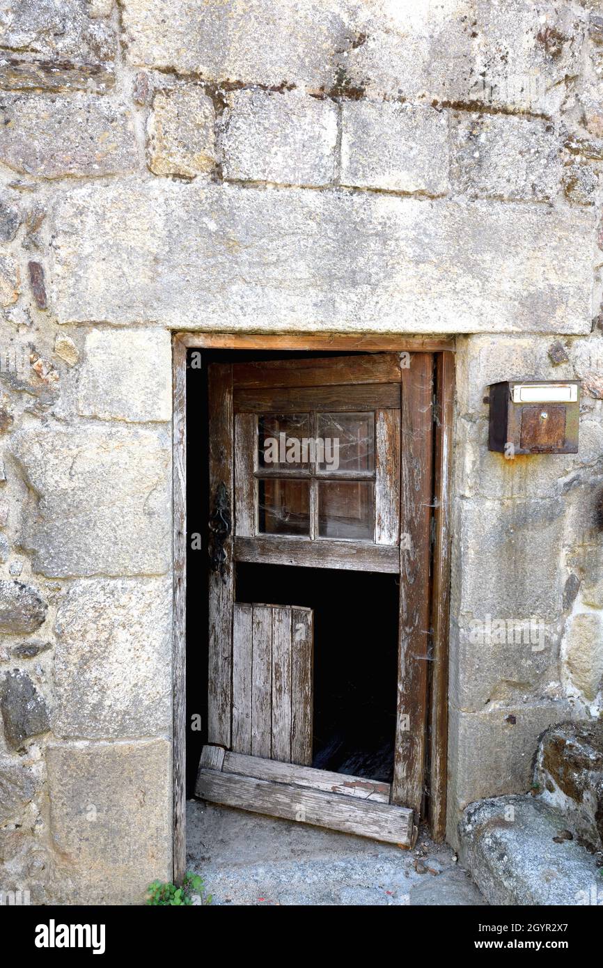 Rotten wooden door of an old house, Linhares de Beira, Historic village ...