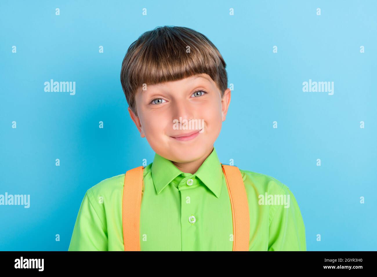 Portrait of attractive cheery funny schoolboy nerd wearing green shirt ...