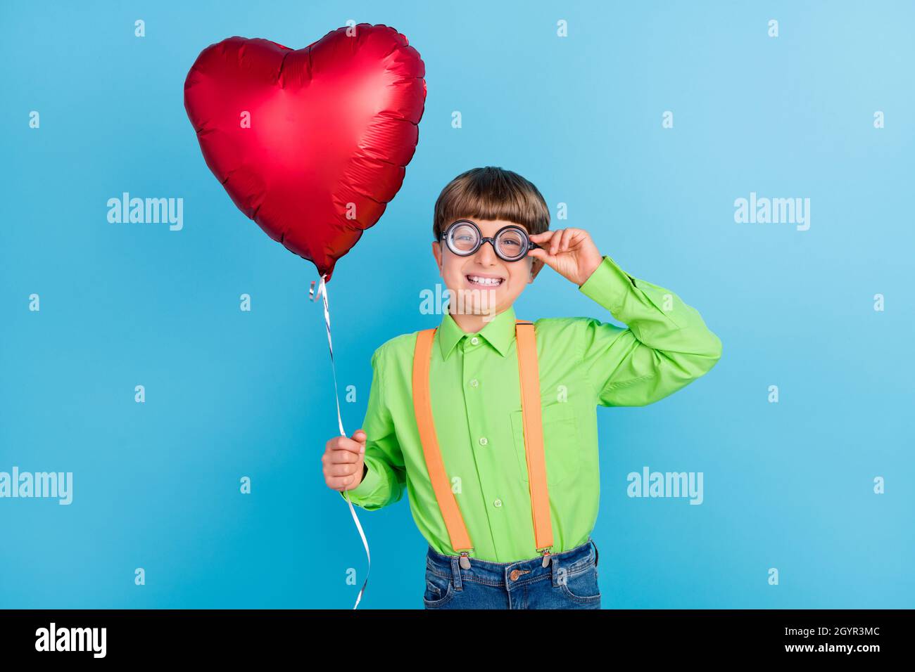 Portrait of handsome trendy brainy funky boy nerd touching specs ...
