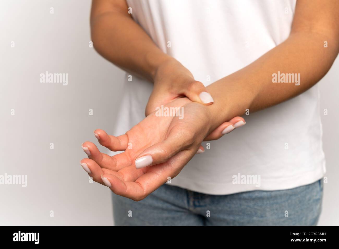 Woman pressing fingers on wrist check pulse. Female touch arm, measure ...