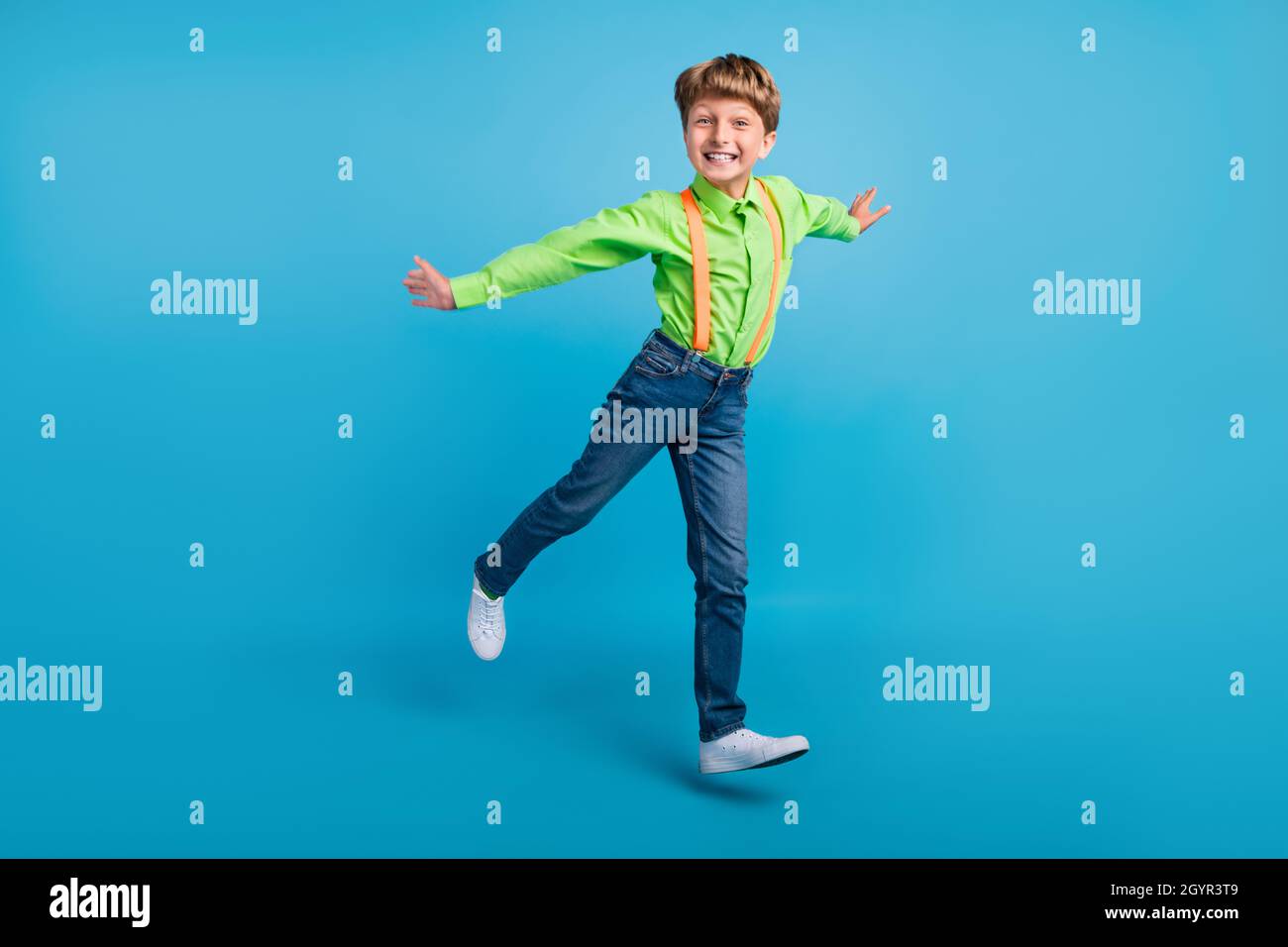 Full size photo of crazy cheerful joyful small boy jump up weekend good ...