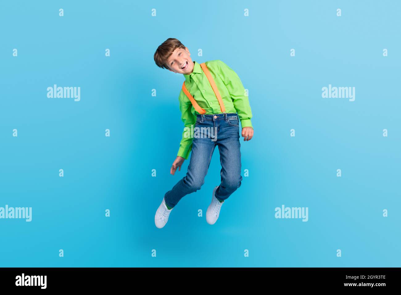 Full body photo of positive happy active small boy jump up good mood ...
