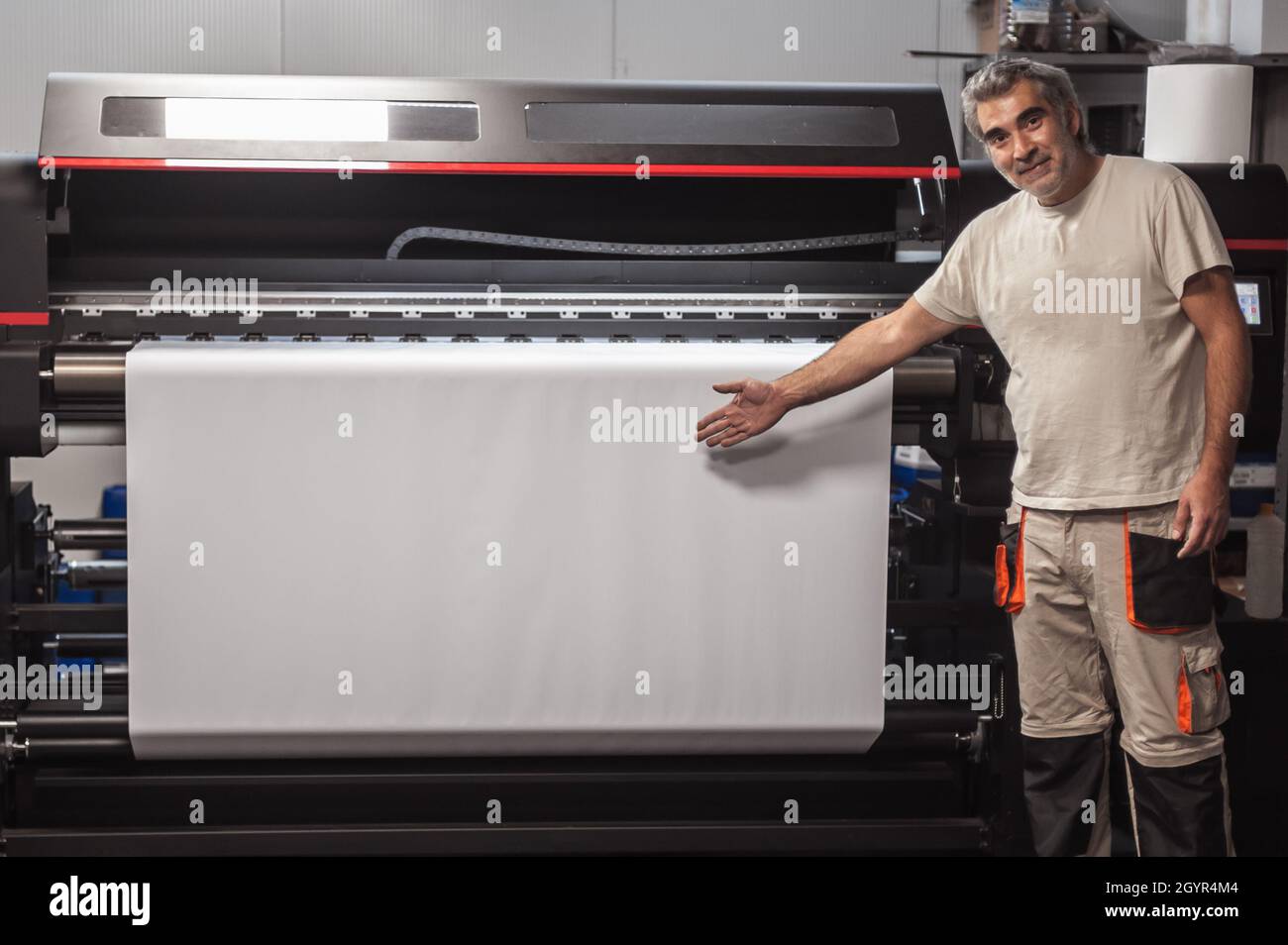 Technician worker operator show and point blank empty space of white ...