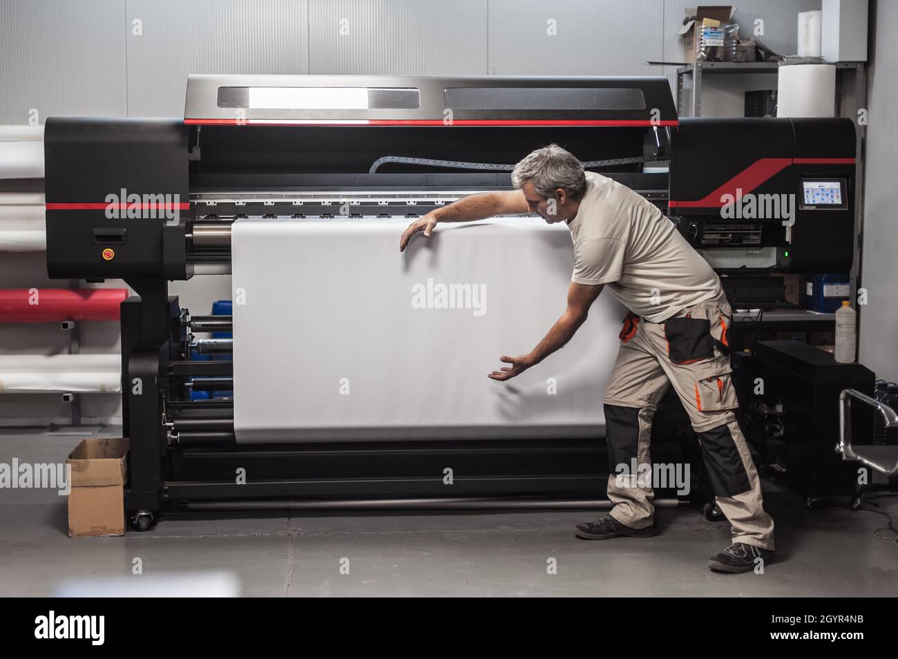 Technician worker operator show and point blank empty space of white ...