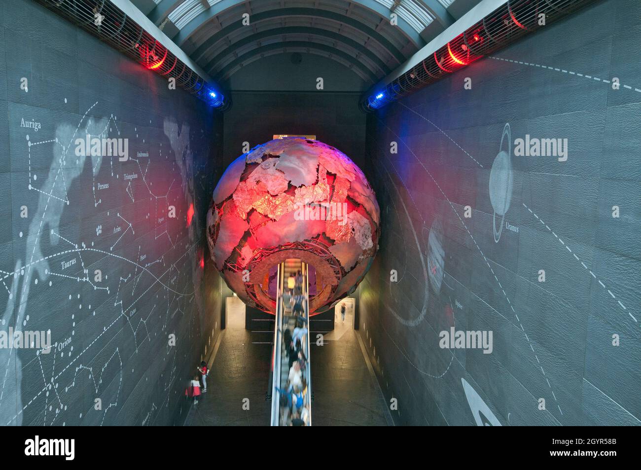 The Earth Hall with escalator leading up into the red globe, Natural ...