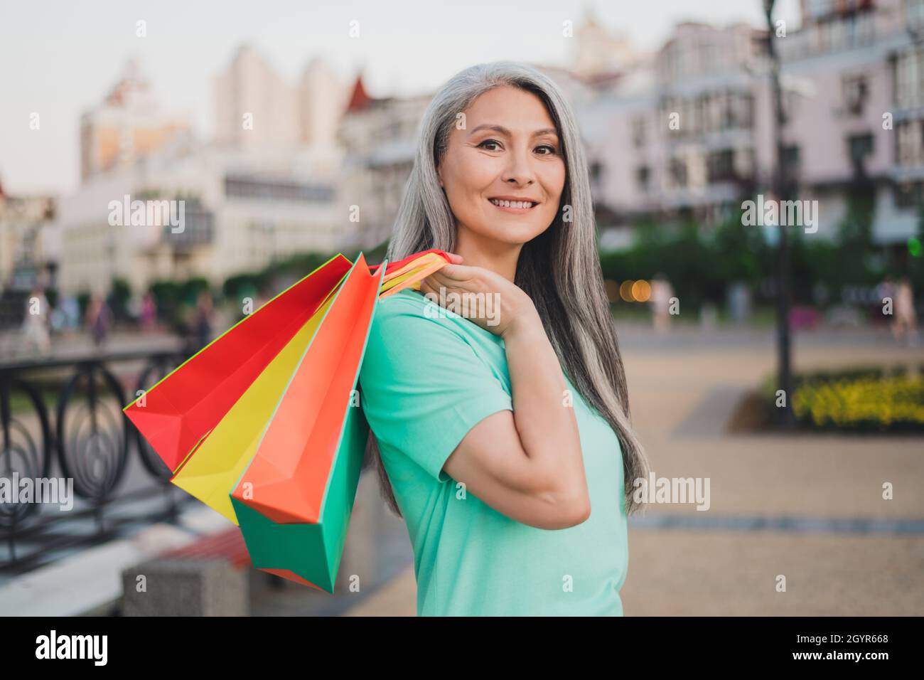 Portrait of attractive cheerful grey-haired retired pensioner woman ...