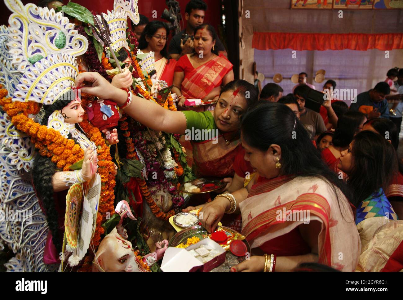 Indian Bengali women take part in a sindoor khela during the Durga puja ...