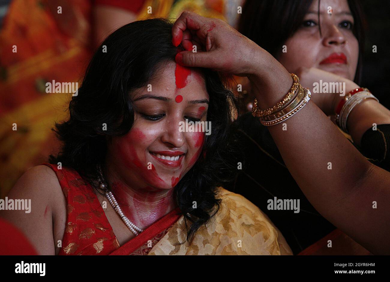 Indian Bengali women take part in a sindoor khela during the Durga puja ...