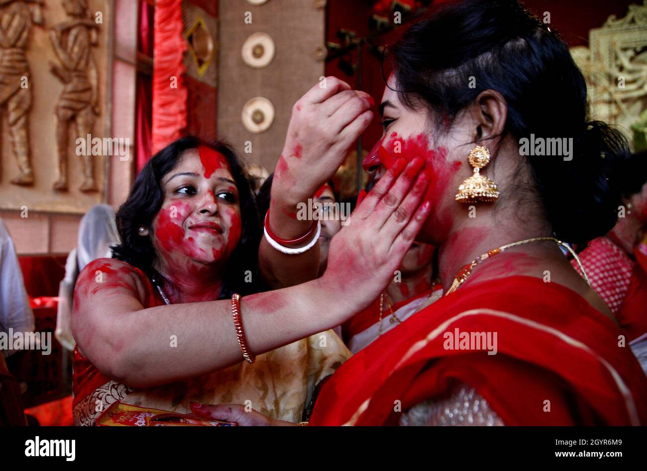 Indian Bengali women take part in a sindoor khela during the Durga puja festival on the occasion ...