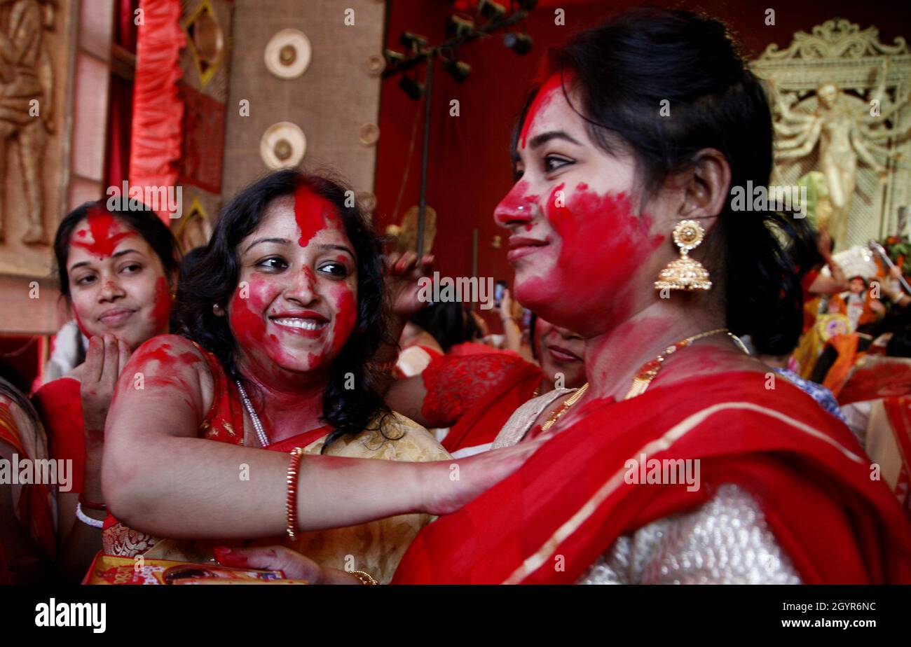 Indian Bengali women take part in a sindoor khela during the Durga puja ...